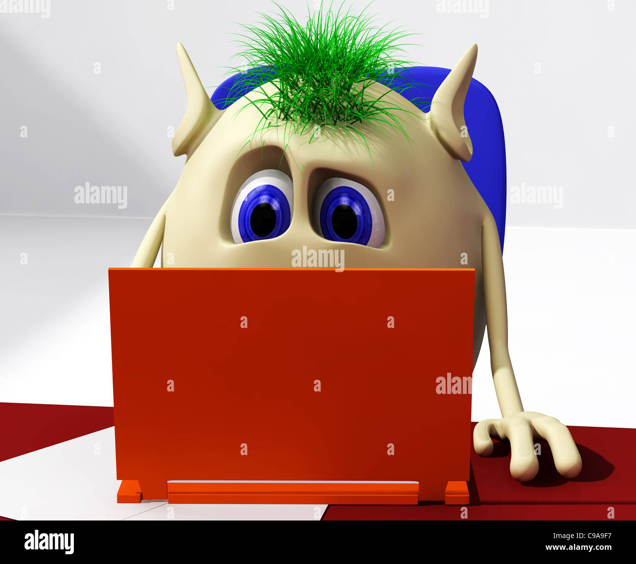 Puppet sitting behind orange laptop on blue chair Stock Photo - Alamy