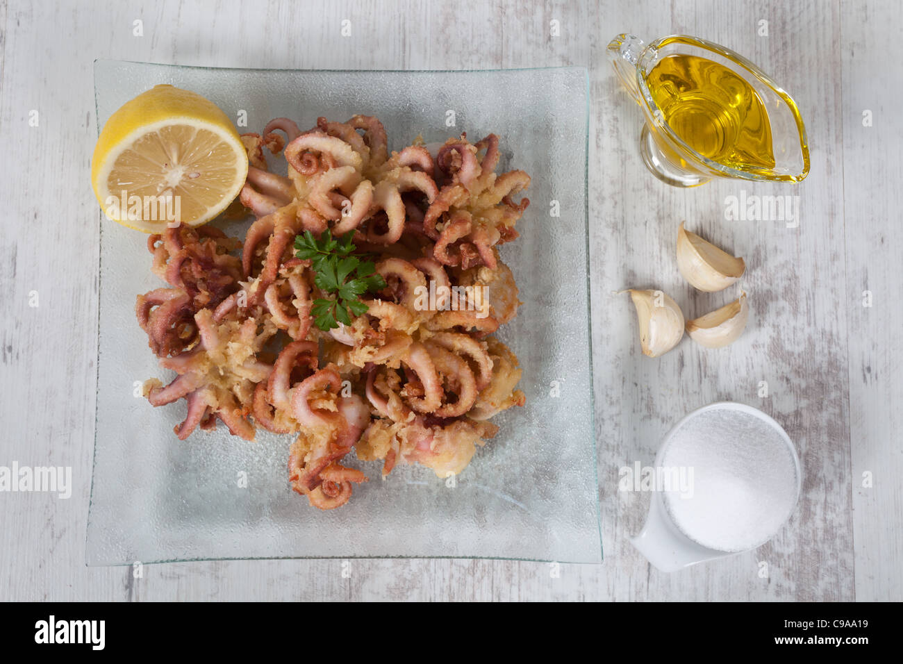 Crusty delicious fried octopus served on a plate Stock Photo - Alamy