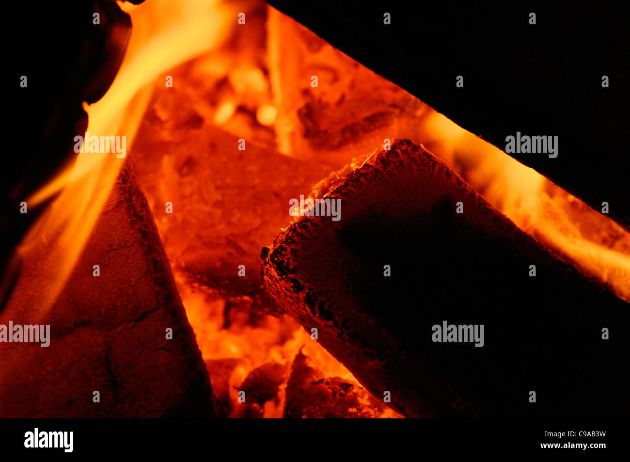 Orange glowing embers in a small wood bonfire Stock Photo - Alamy