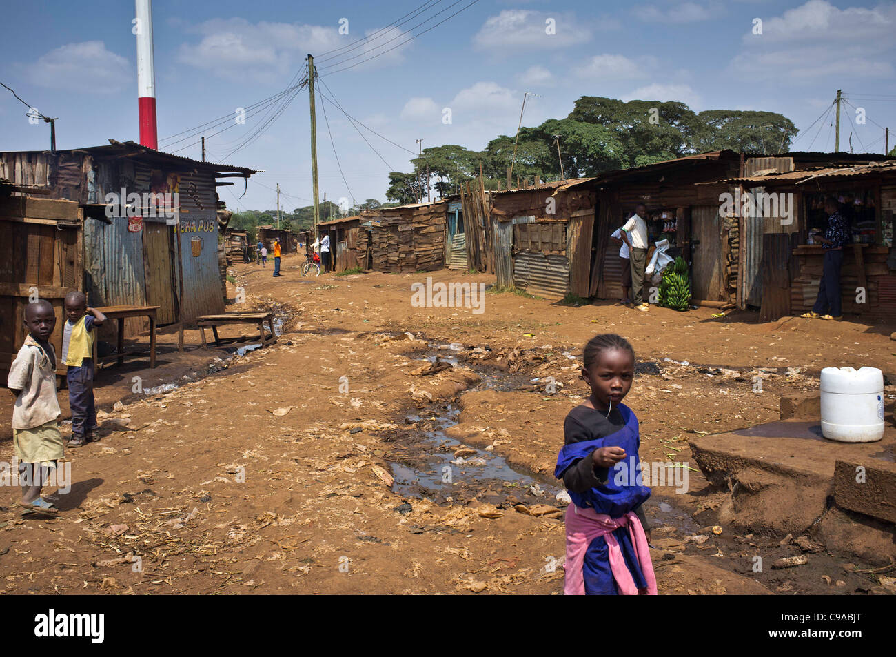 A street scene in the Kiandutu slum. Open sewers are a regular scene in ...