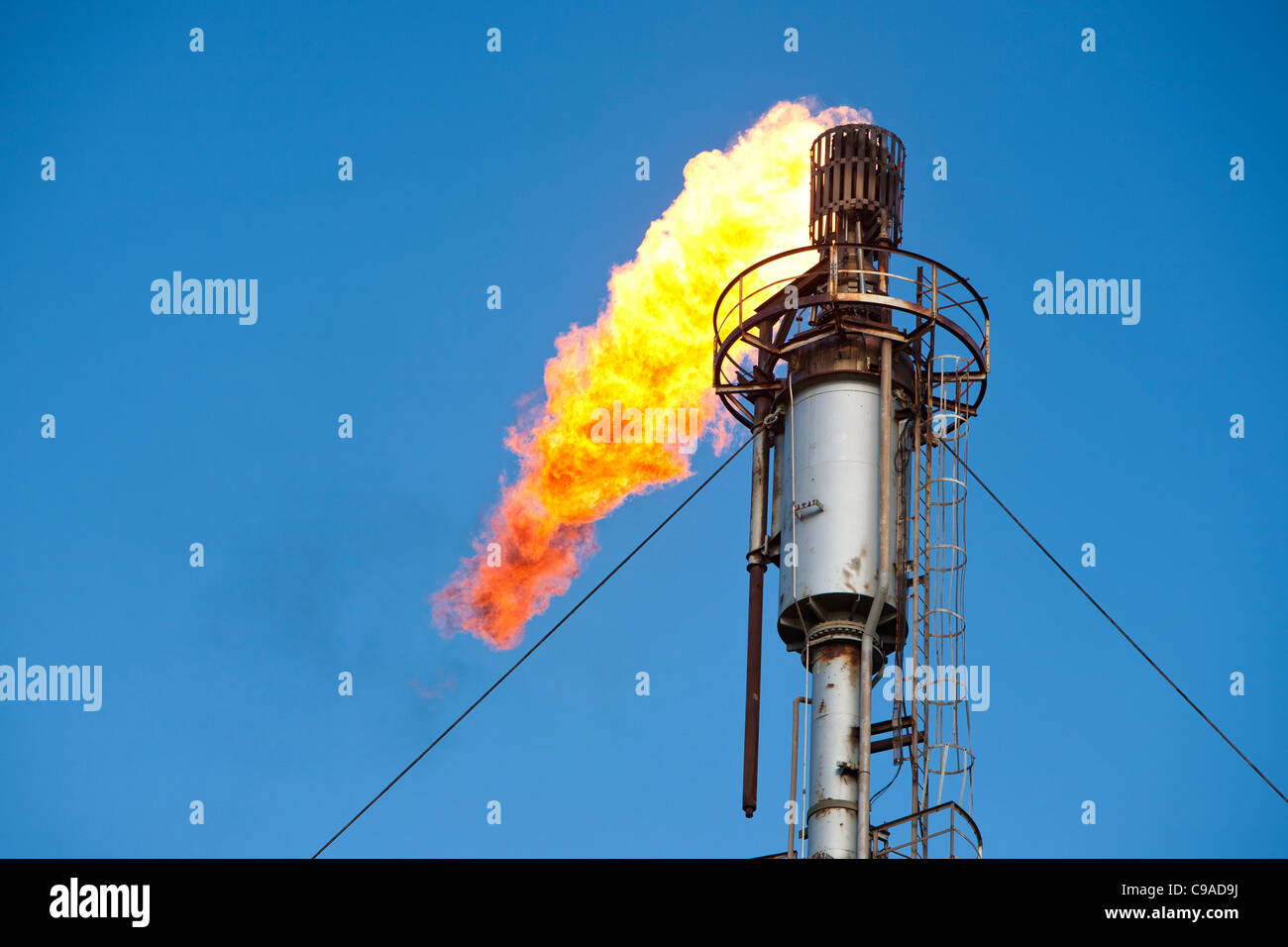 Flaring off gas at the Flotta oil terminal on the Island of Flotta in ...