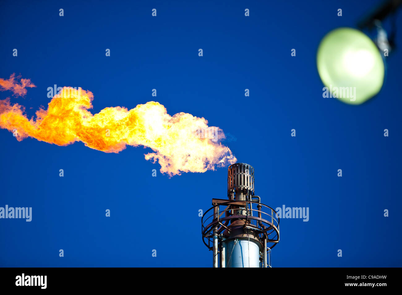 Flaring off gas at the Flotta oil terminal on the Island of Flotta in ...