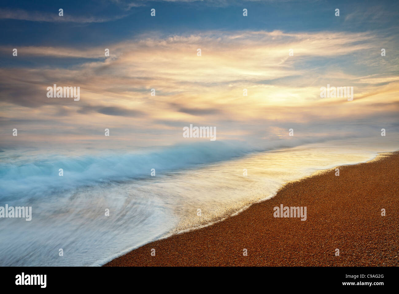 Sea mist blending of the sunset sky and sea Stock Photo - Alamy