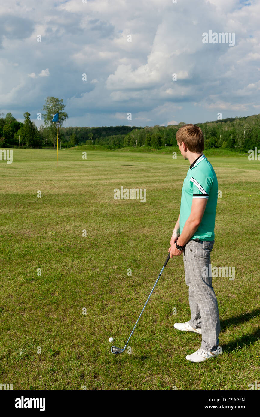Man with clubs on field hi-res stock photography and images - Alamy