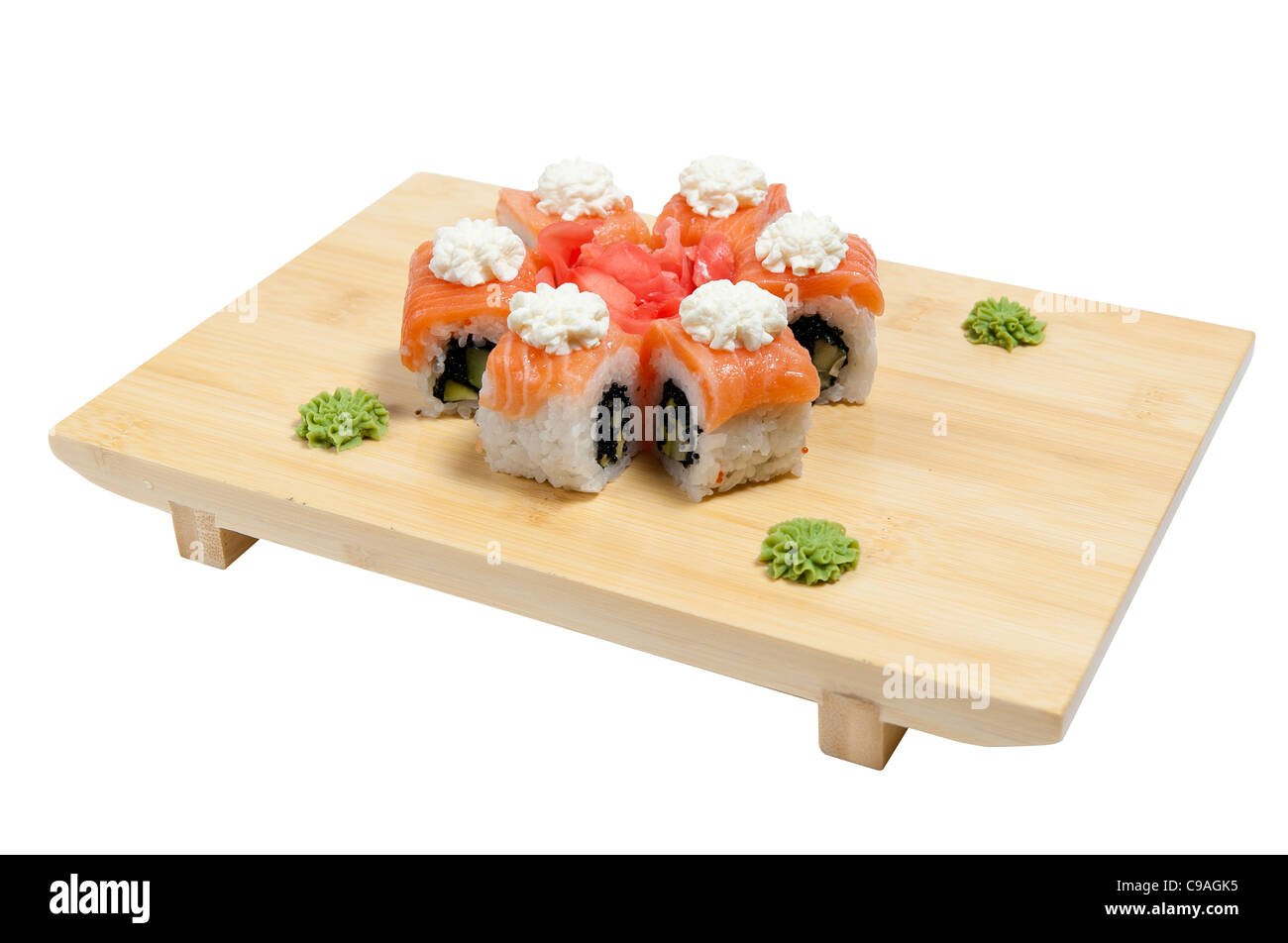 Sushi on wooden stand isolated on white background Stock Photo - Alamy