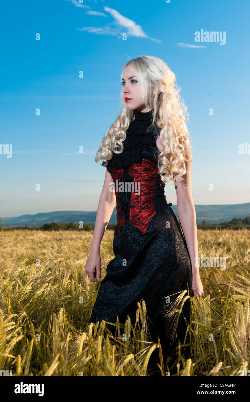 Portrait of beautiful girl blonde gothic in wheat field Stock Photo - Alamy