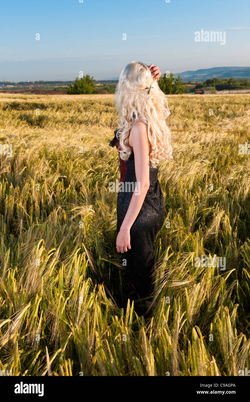 Portrait of beautiful girl blonde gothic in wheat field Stock Photo - Alamy