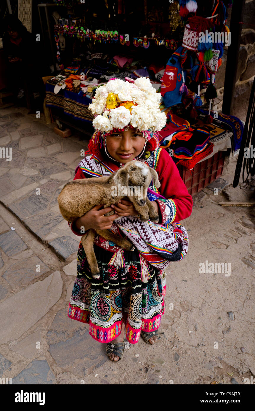 Young girl with lamb wearing traditional Quechua costume in Aguas ...