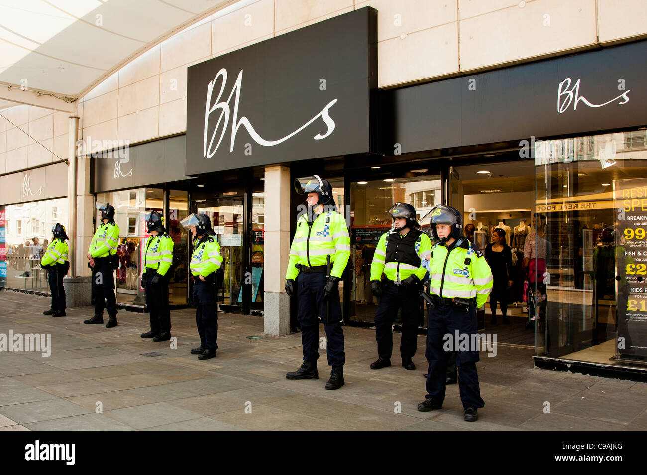 Riot police standing guard outside BHS at Brighton's Churchill square ...
