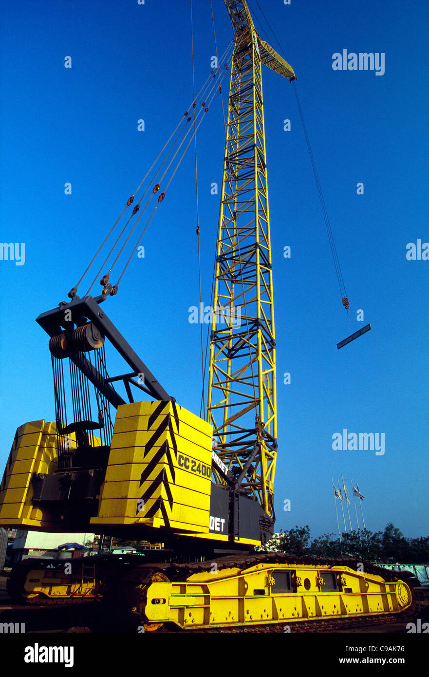 Large crane at cement plant under construction in Cilicap, Java ...