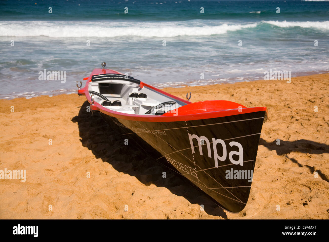 traditional surf lifeboat resting on the waters edge,sydney Stock Photo ...