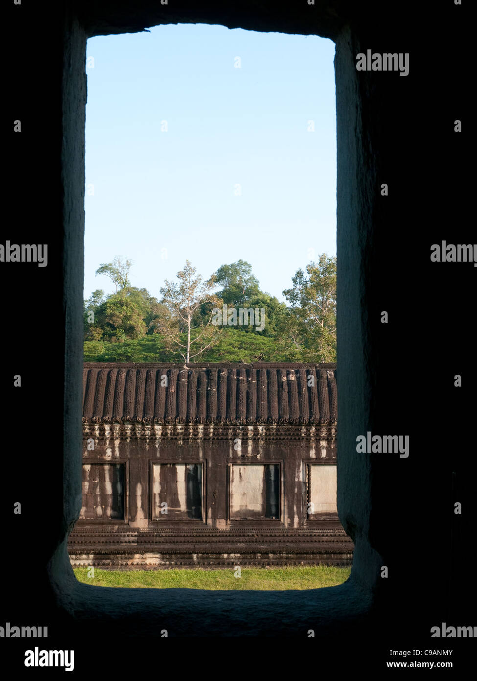 The surrounding wall at Angkor Wat seen through a window of the main ...