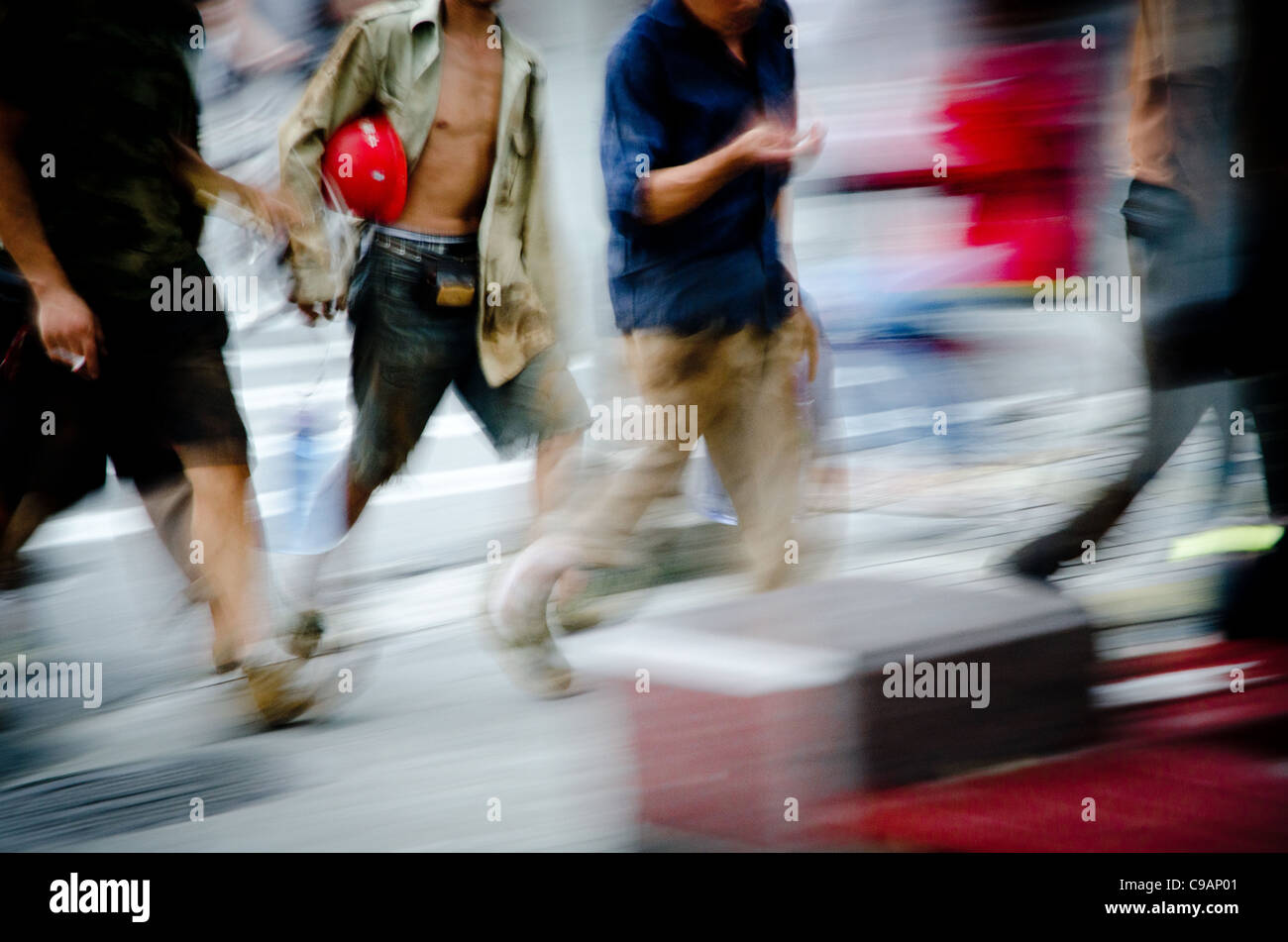 Chinese worker on zebra crossing street Stock Photo - Alamy