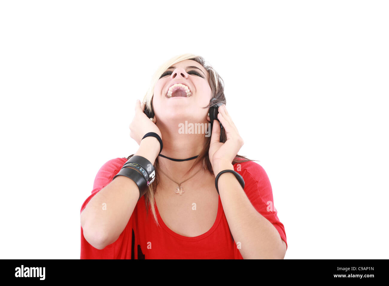 Young woman with a cool rocker style listening to music Stock Photo - Alamy