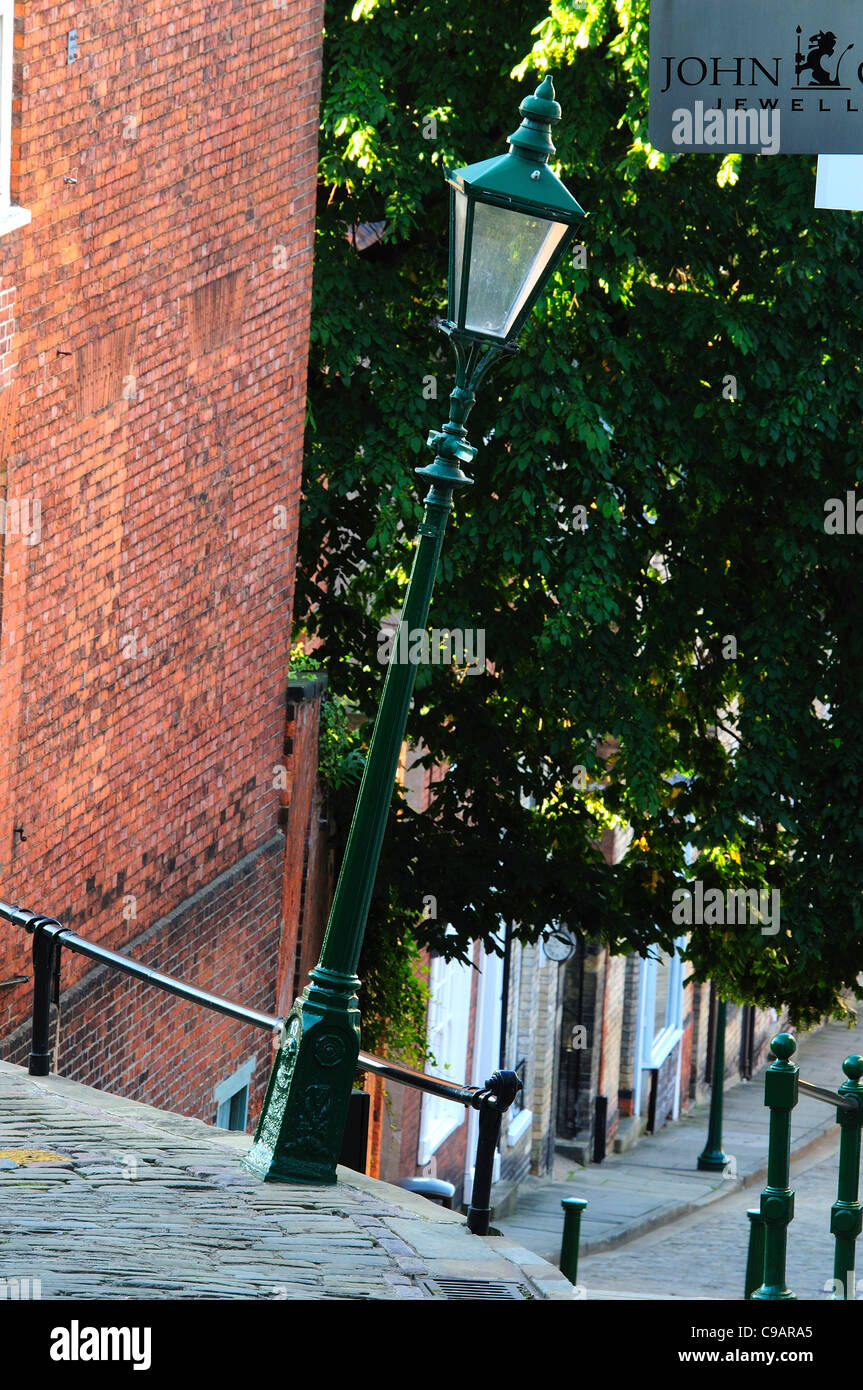 A very crooked lamp post in Lincoln on Steep Street UK Stock Photo - Alamy