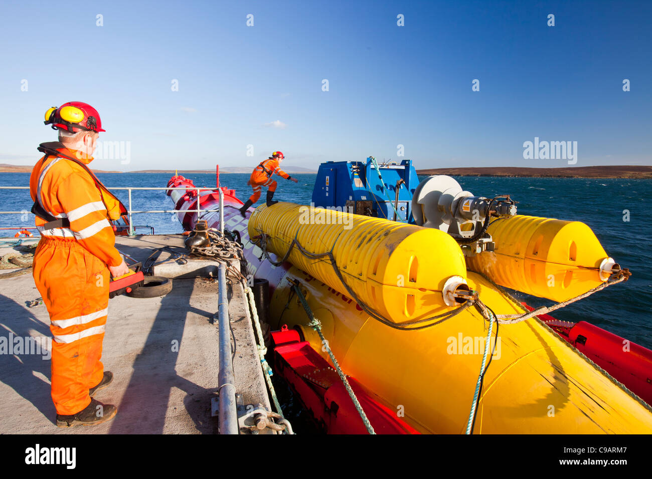 A Pelamis P2 wave energy generator on the dockside at Lyness on Hoy ...