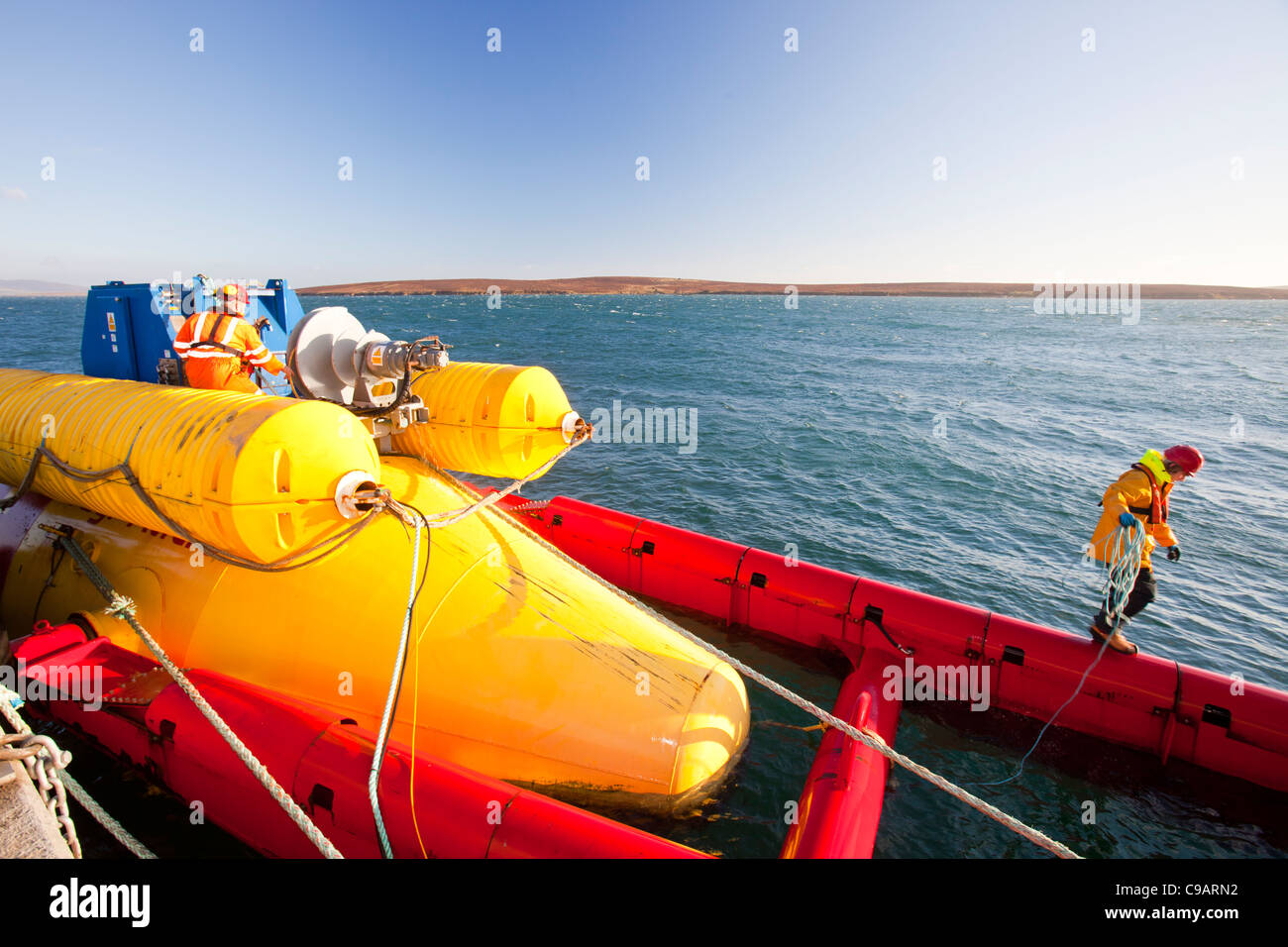 A Pelamis P2 wave energy generator on the dockside at Lyness on Hoy ...