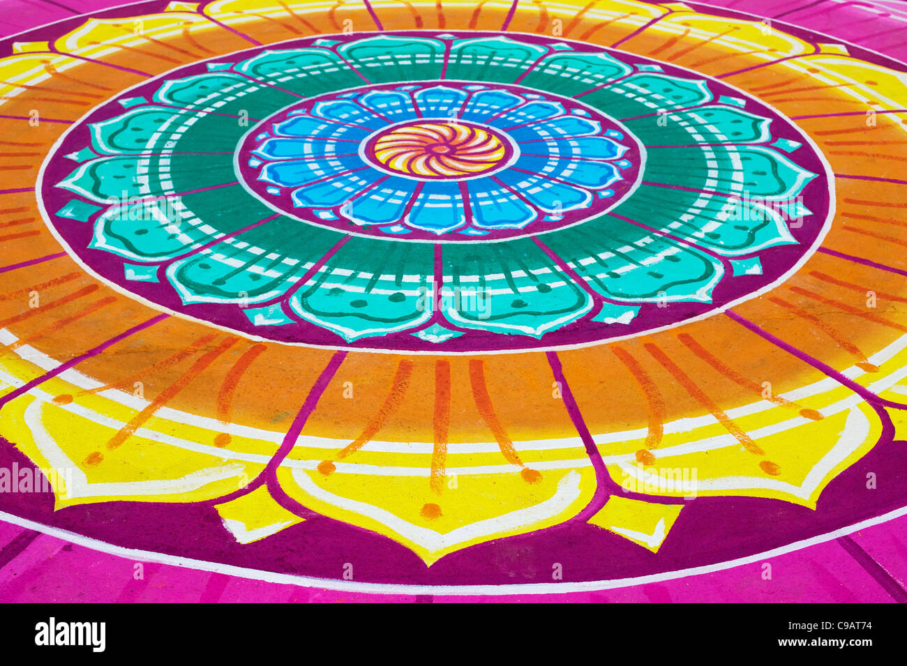 Multicoloured Indian Lotus pattern painted on the streets of ...