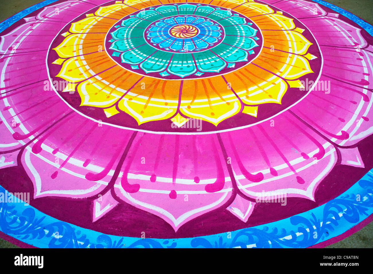 Multicoloured Indian Lotus pattern painted on the streets of ...