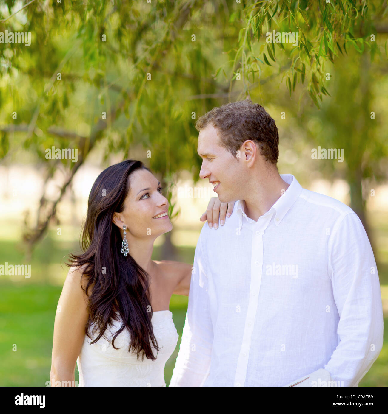 couple in love happy in green park outdoor under trees Stock Photo - Alamy