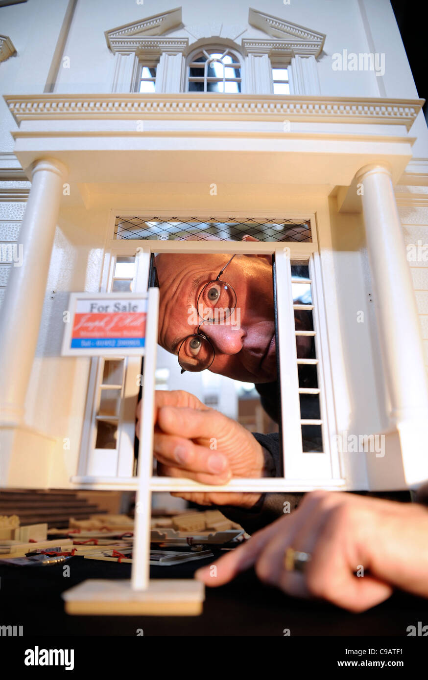 A miniatura enthusiast places a for sale outside his regency mansion ...