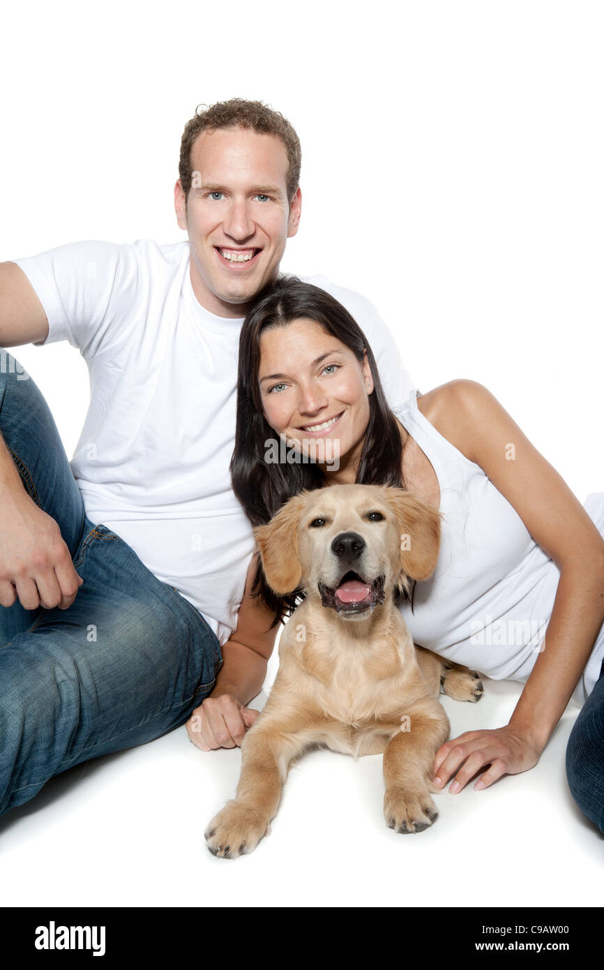 couple in love with puppy dog golden retriever isolated on white Stock ...
