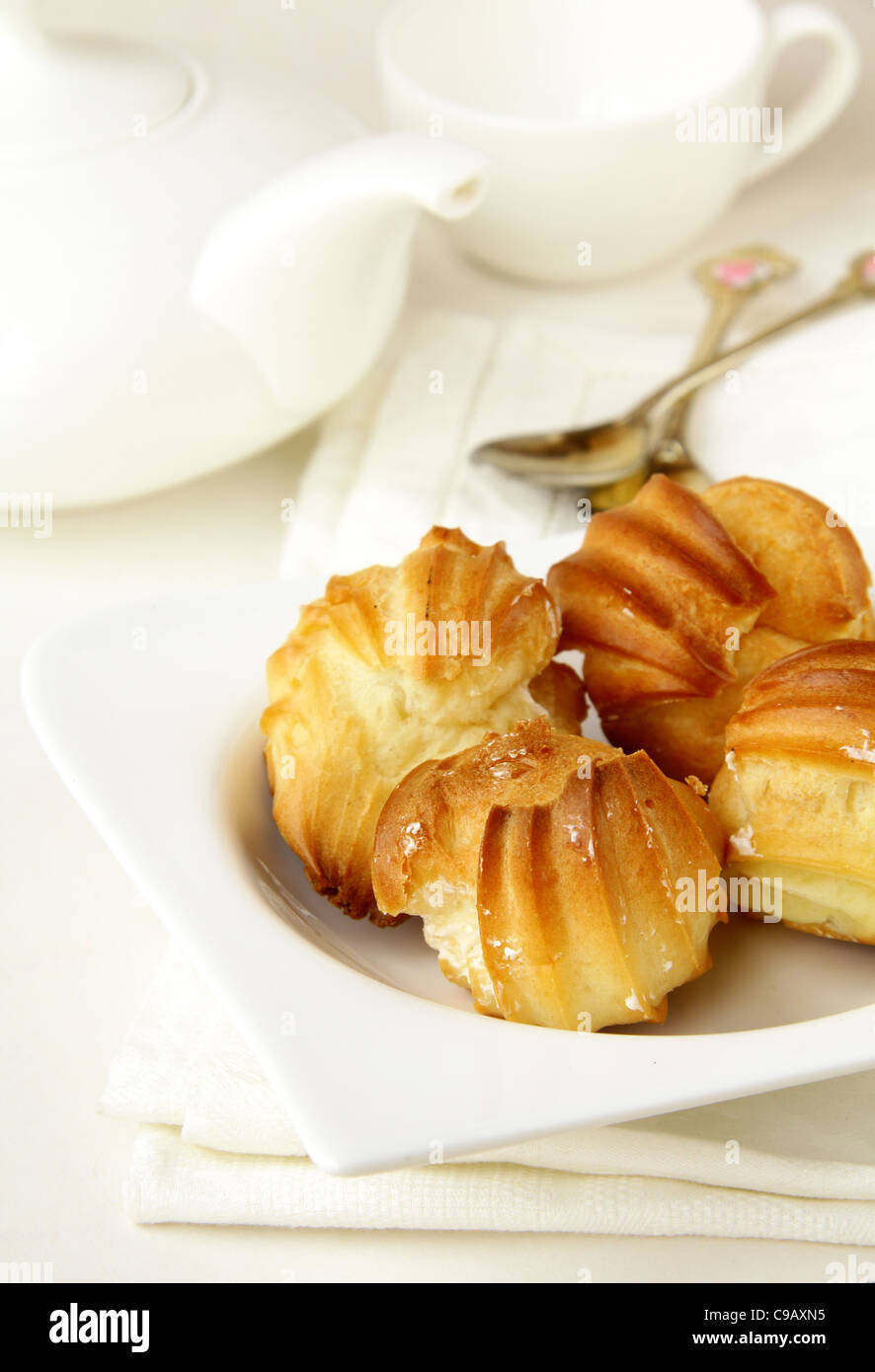 cake profiteroles on a plate, white background Stock Photo - Alamy