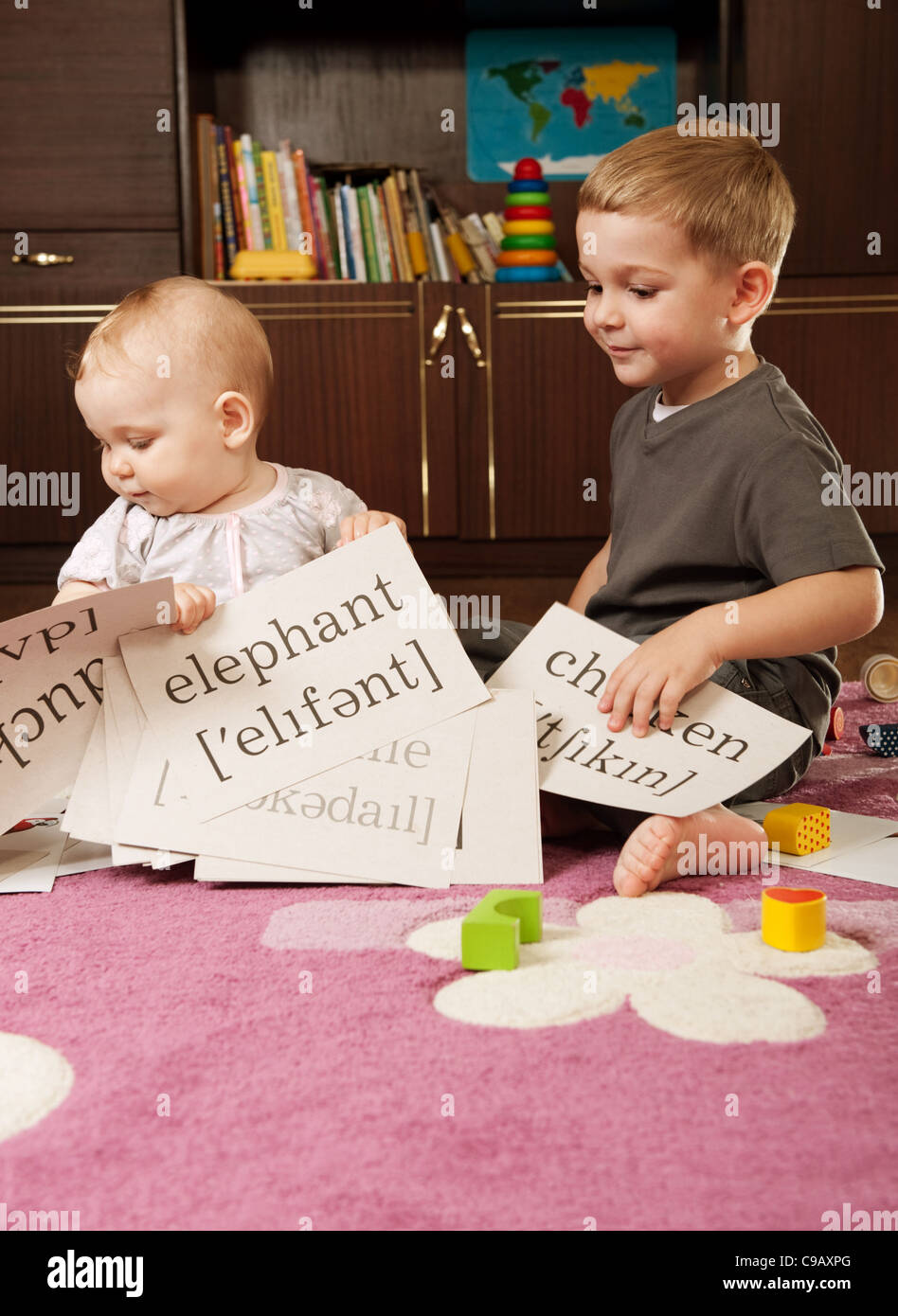 Brother sister playing cards hi-res stock photography and images - Alamy