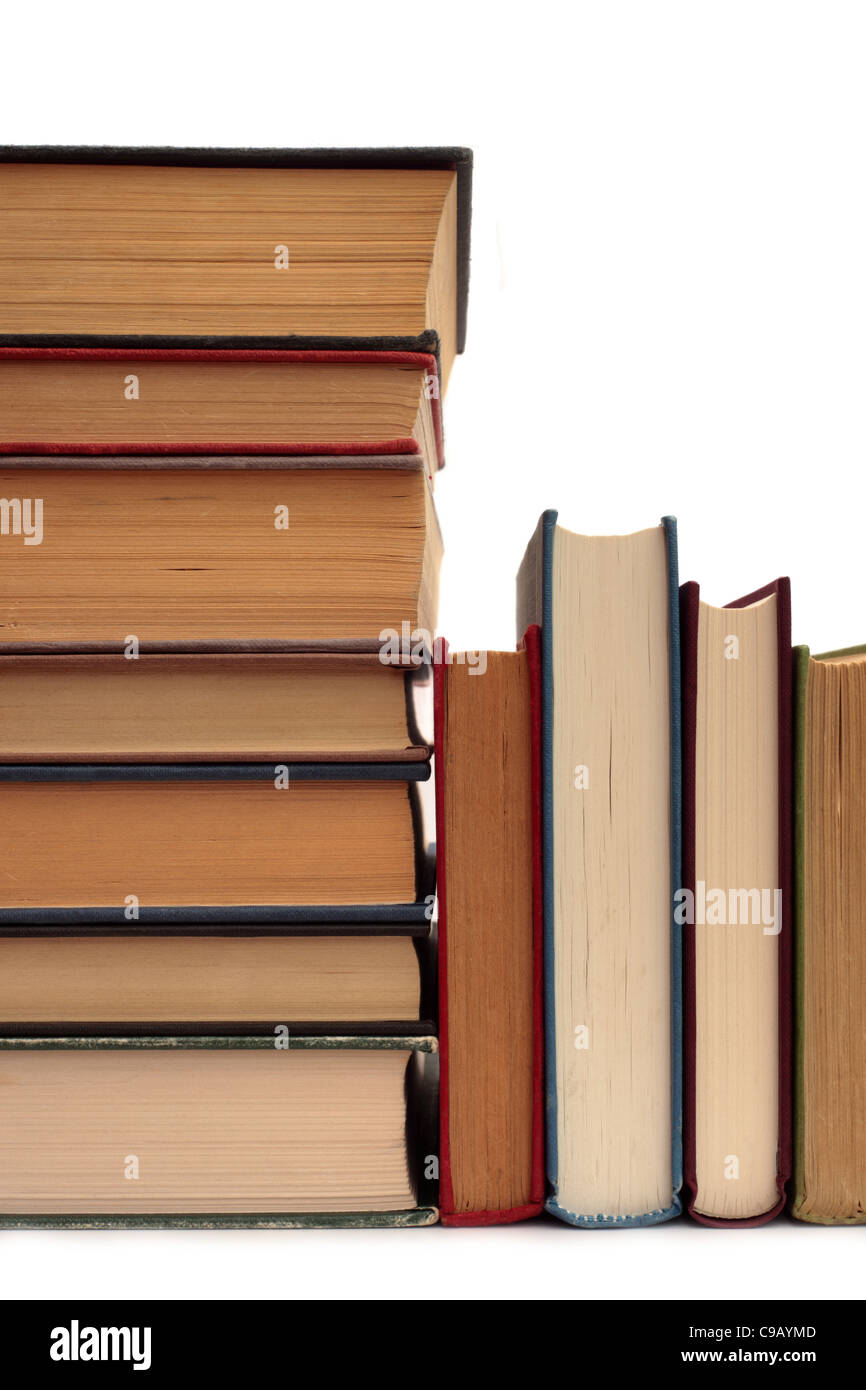 Stacked hardback books, both old and new, with a white background Stock ...