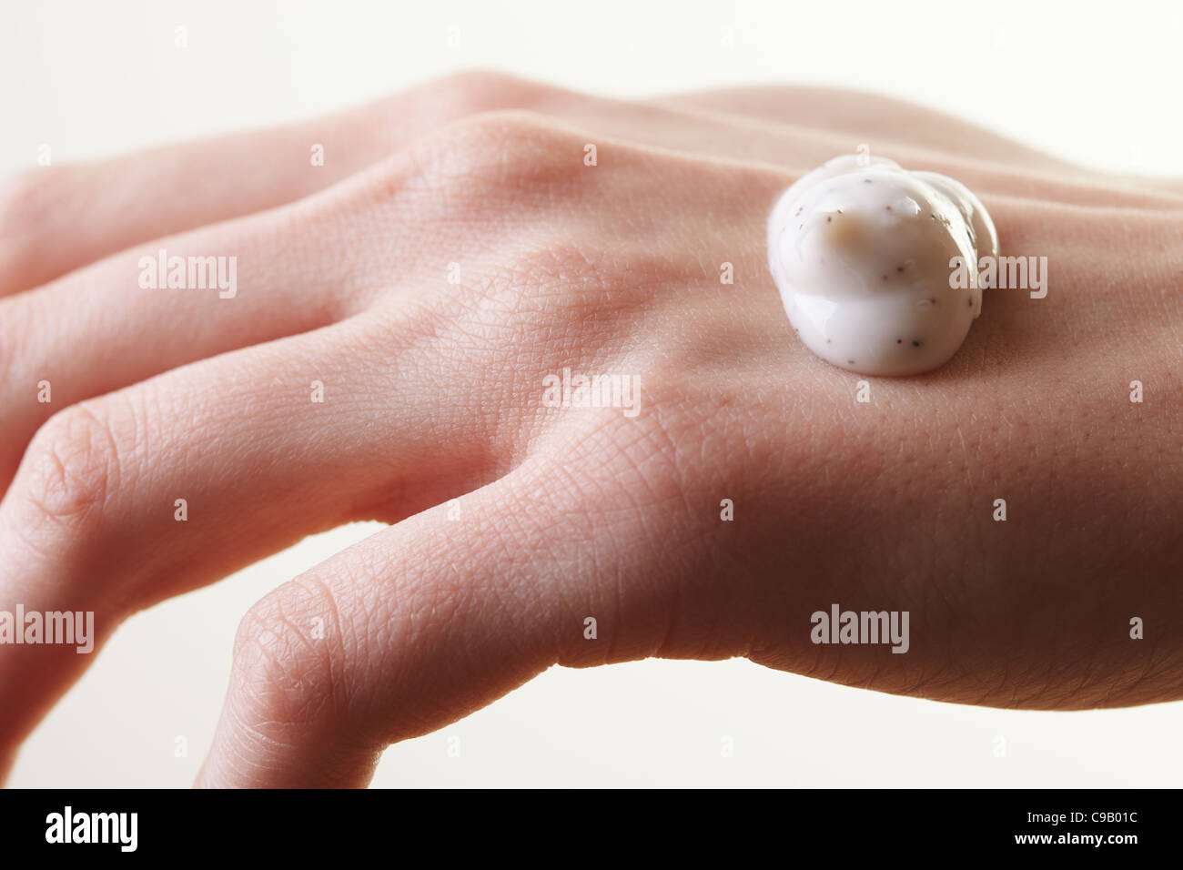 Woman putting cream Stock Photo - Alamy