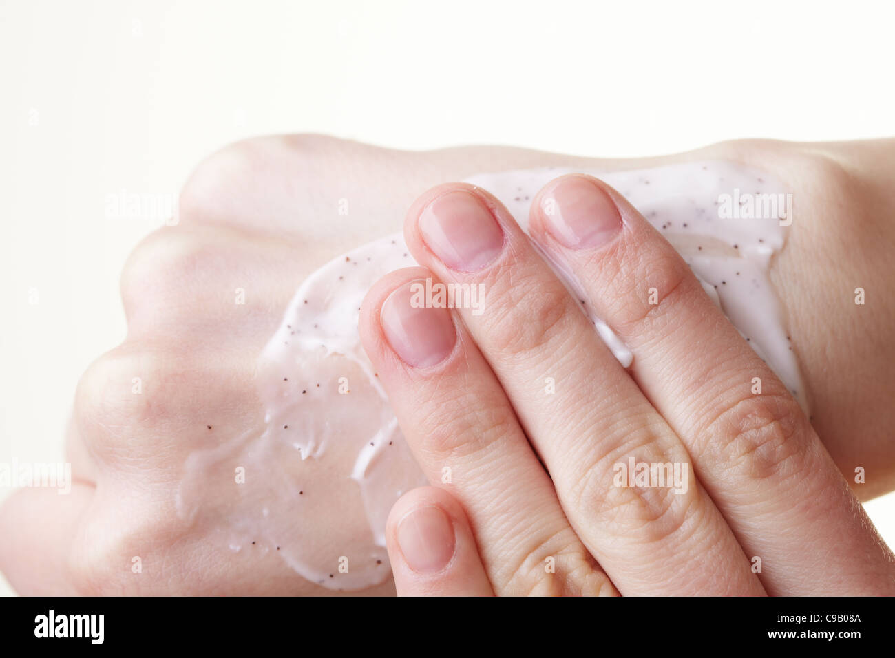 Woman putting cream Stock Photo - Alamy