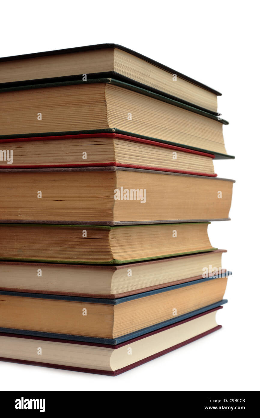 Stacked hardback books, both old and new, with a white background Stock ...