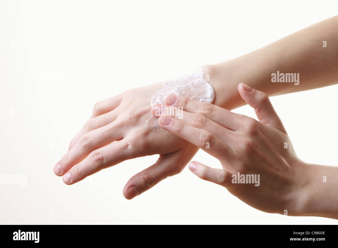Woman putting cream Stock Photo - Alamy