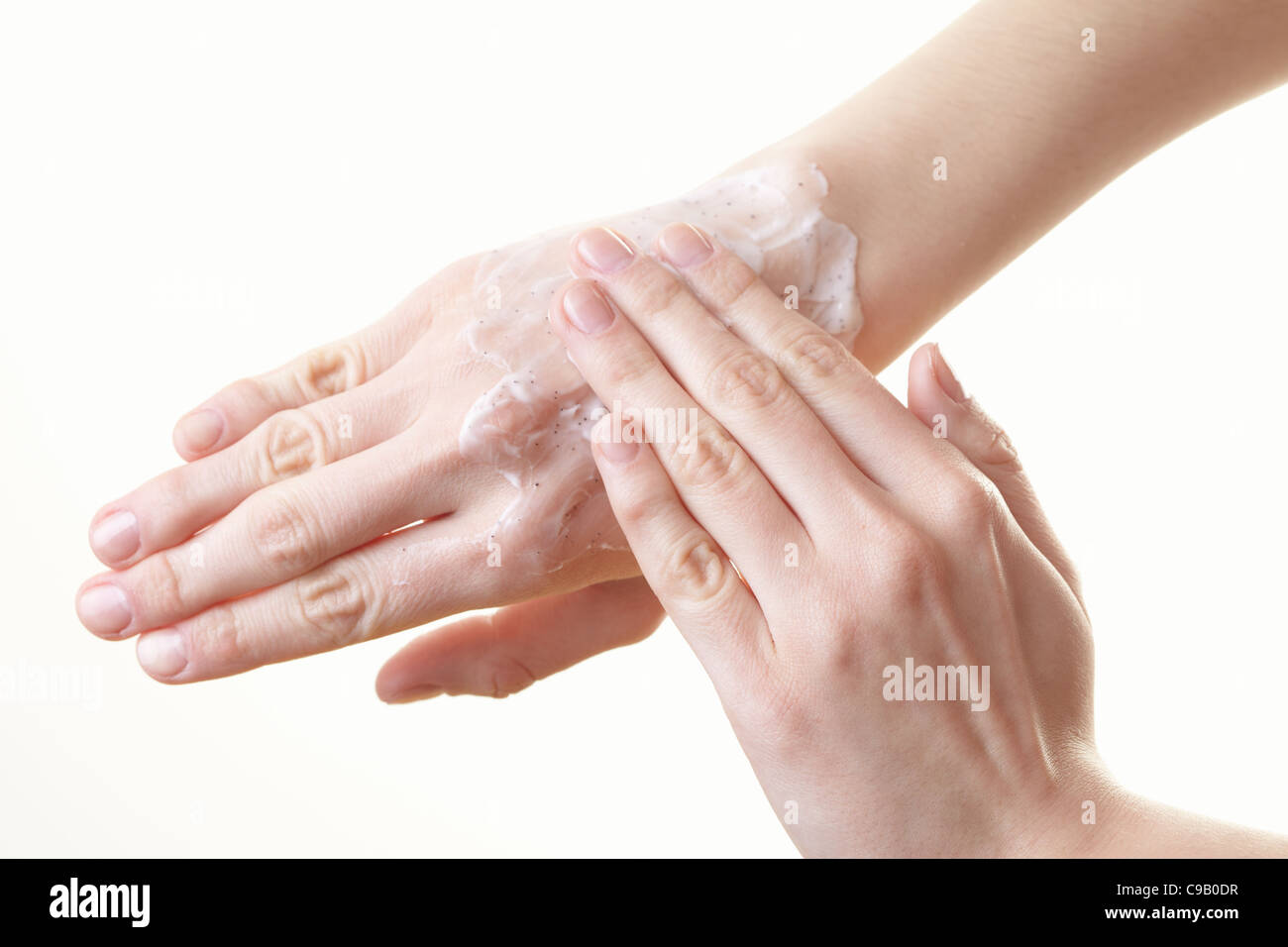 Woman putting cream Stock Photo - Alamy