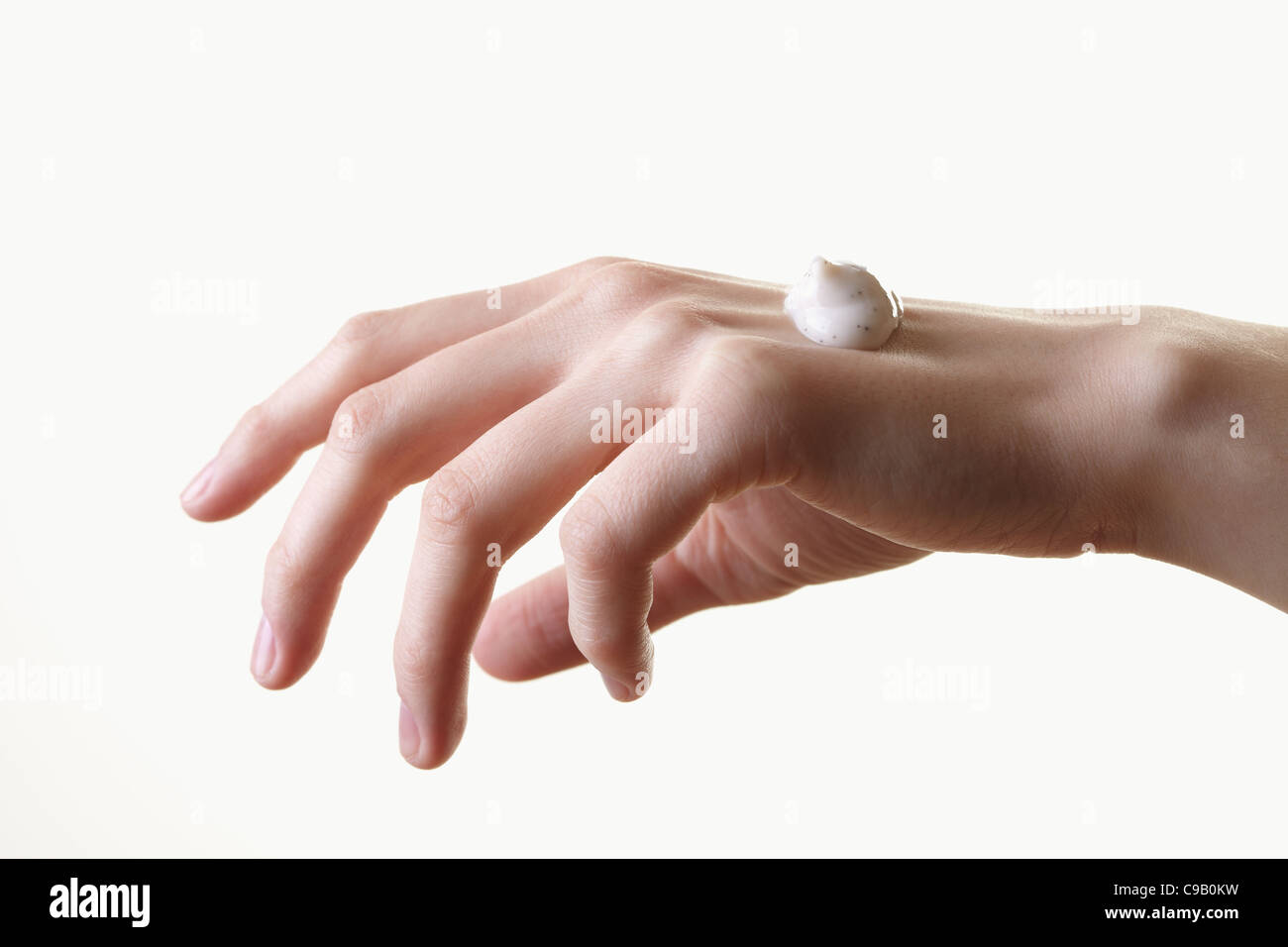 Woman putting cream Stock Photo - Alamy
