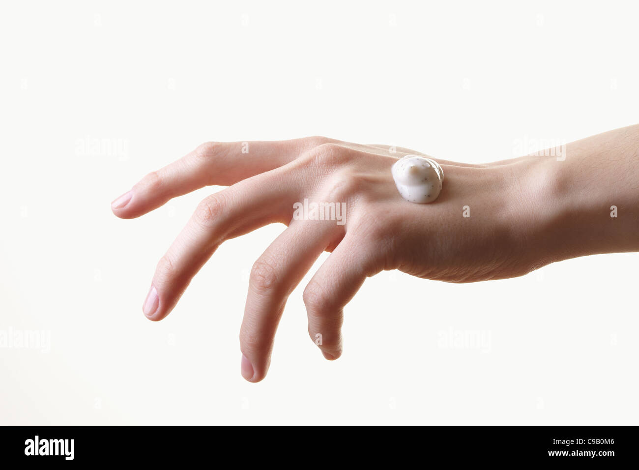 Woman putting cream Stock Photo - Alamy