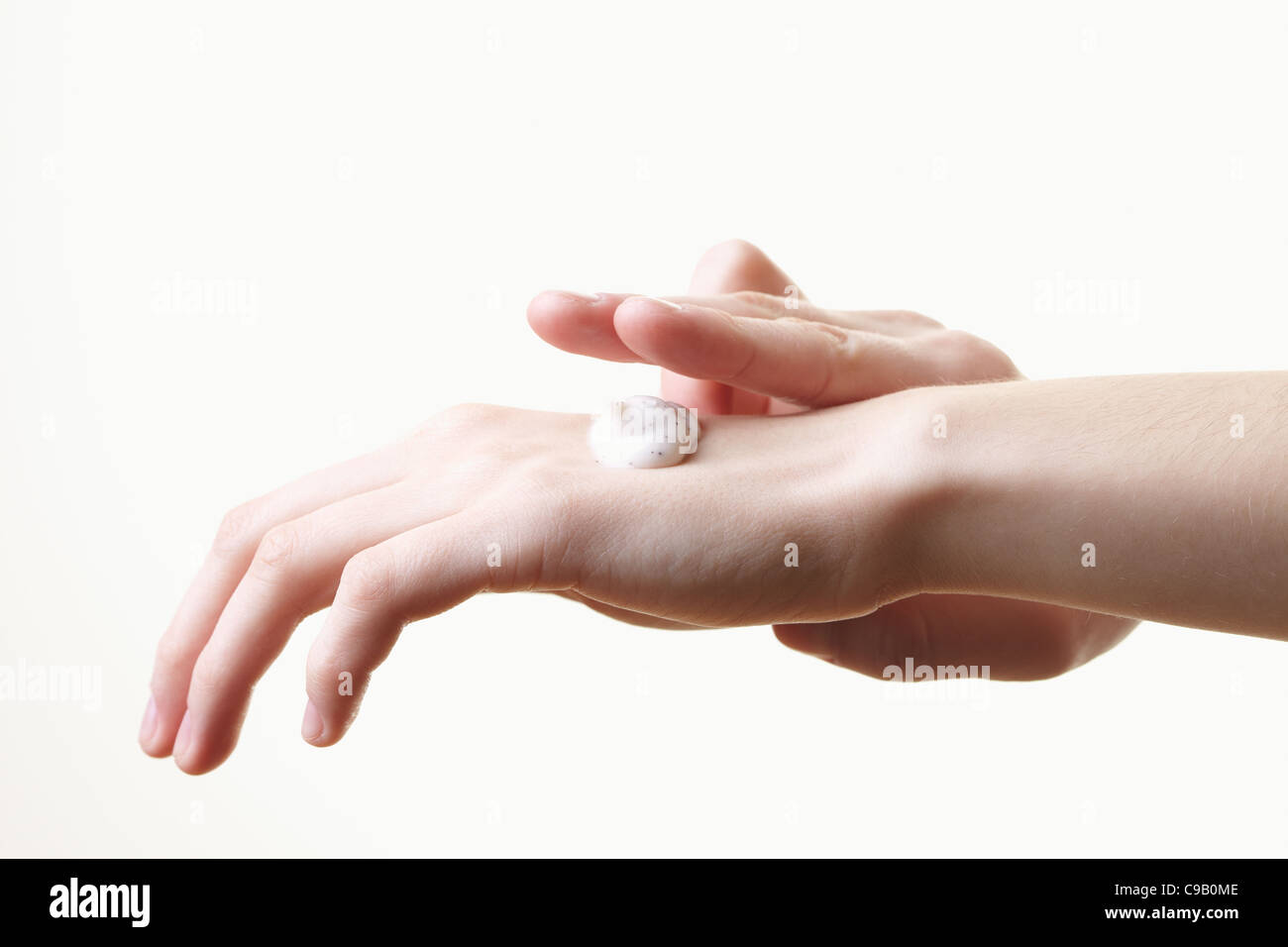 Woman putting cream Stock Photo - Alamy