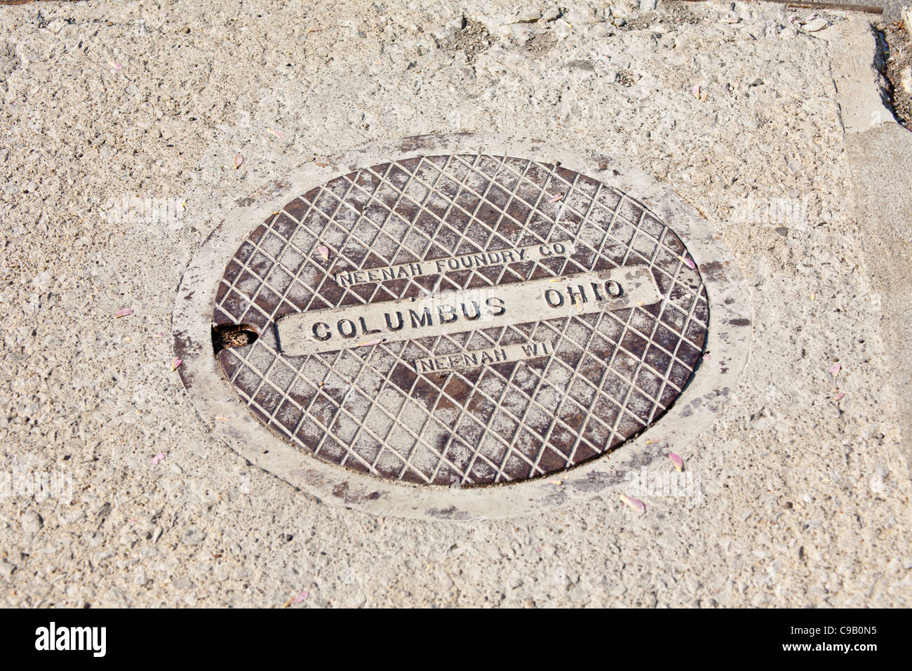 Manhole cover in Columbus, Ohio produced by the Neenah Foundry Company ...