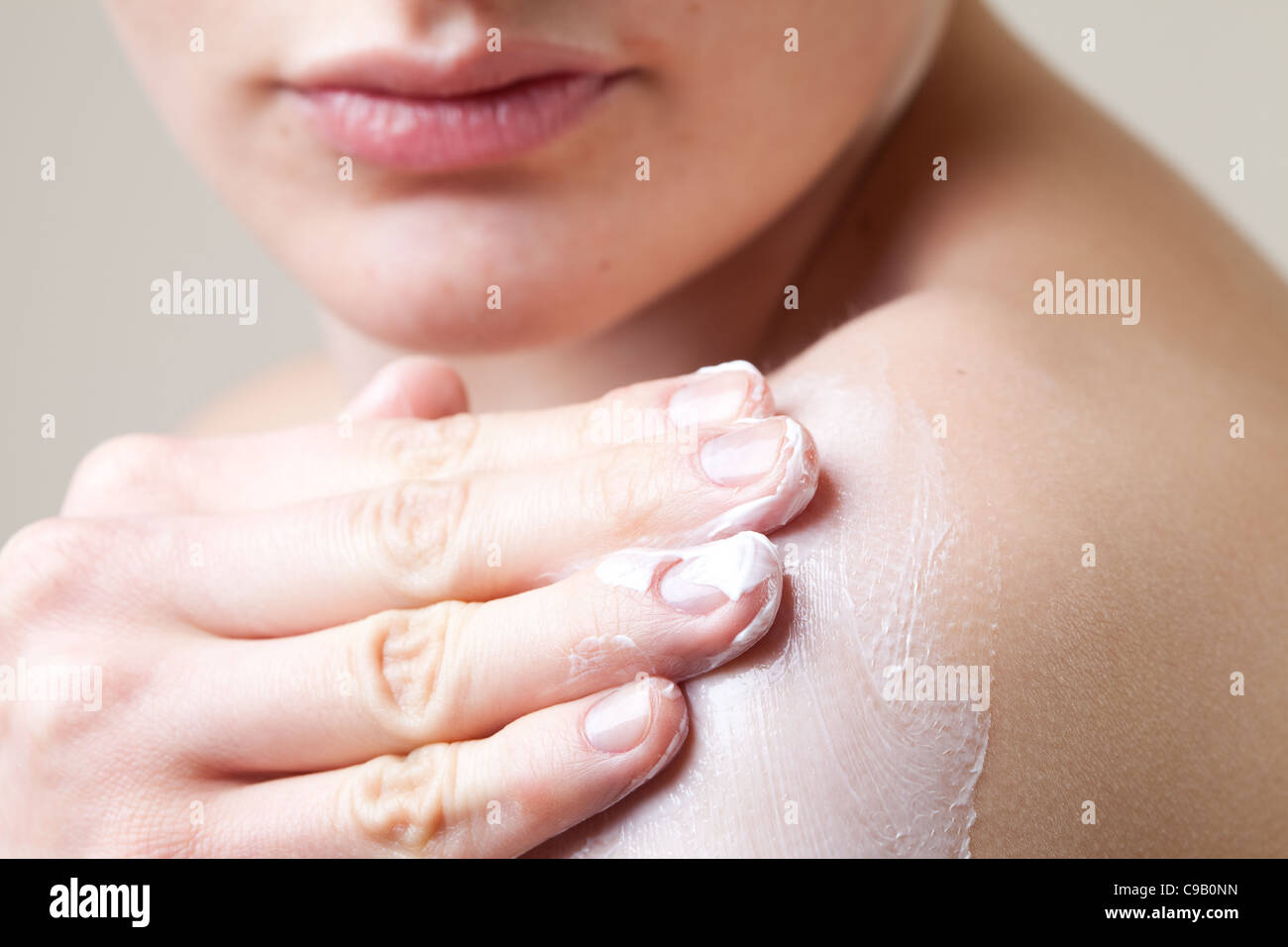 Woman putting cream Stock Photo - Alamy