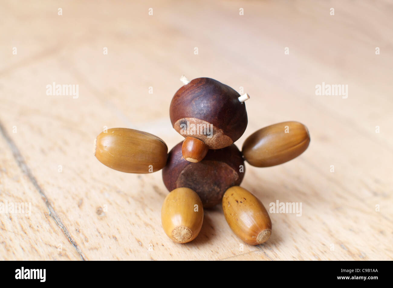 Small figurines made from chestnuts, hazelnuts and acorn Stock Photo ...