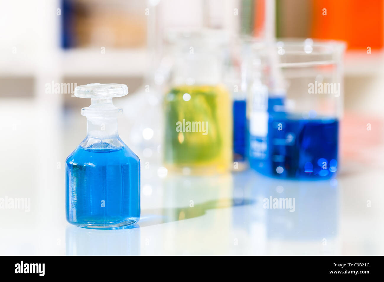 Glass bottle with blue liquid in a laboratory Stock Photo - Alamy