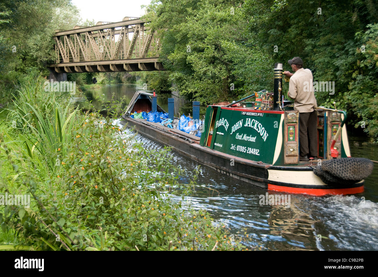Working narrowboat carrying coal Stock Photo - Alamy