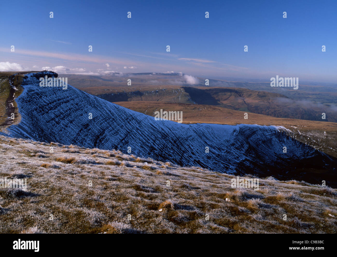 Summit of Corn Du in snow with view west over Fforest Fawr Geopark ...