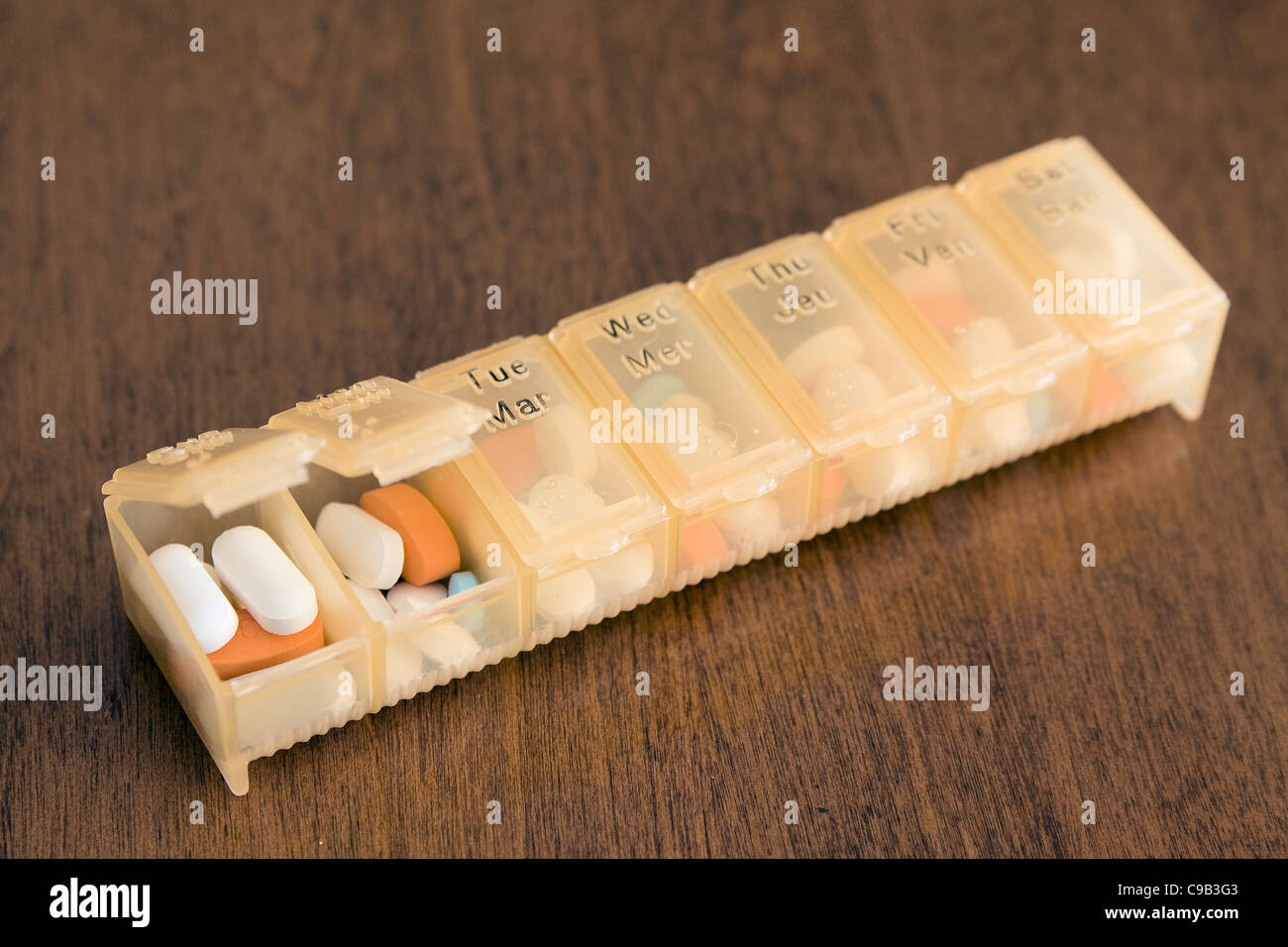 Weekly medication box with vitamins Stock Photo - Alamy