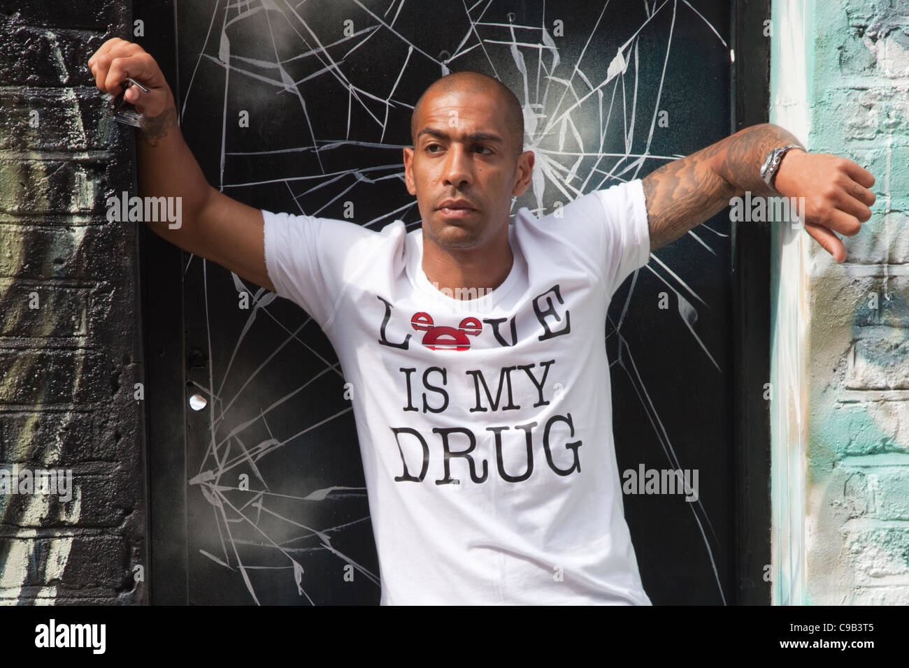 Young mixed race british man tattoos hi-res stock photography and ...