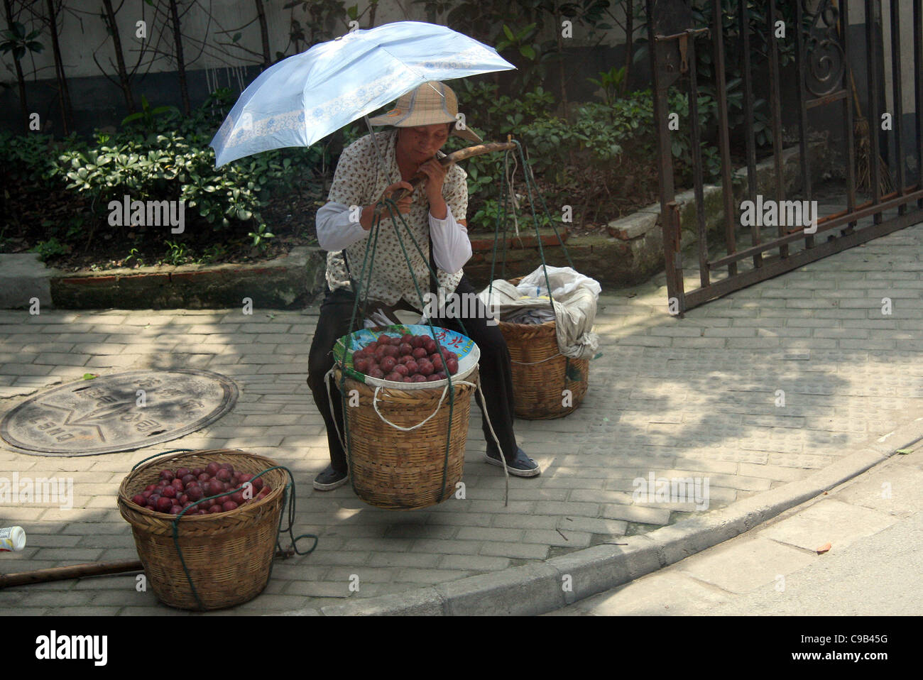 Woman carrying parasol hi-res stock photography and images - Alamy