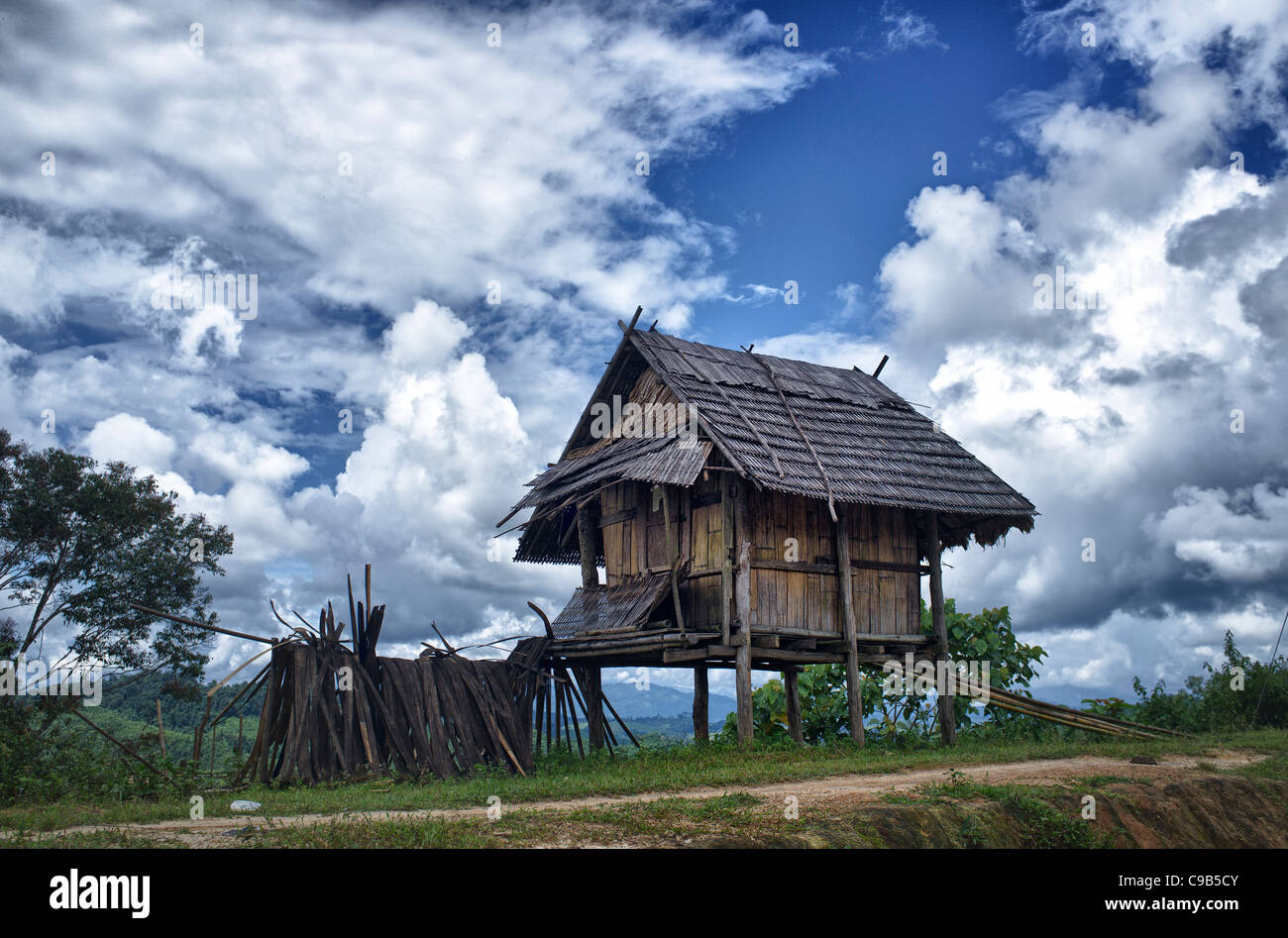 Laos farmer's hut under a blue sky Stock Photo - Alamy