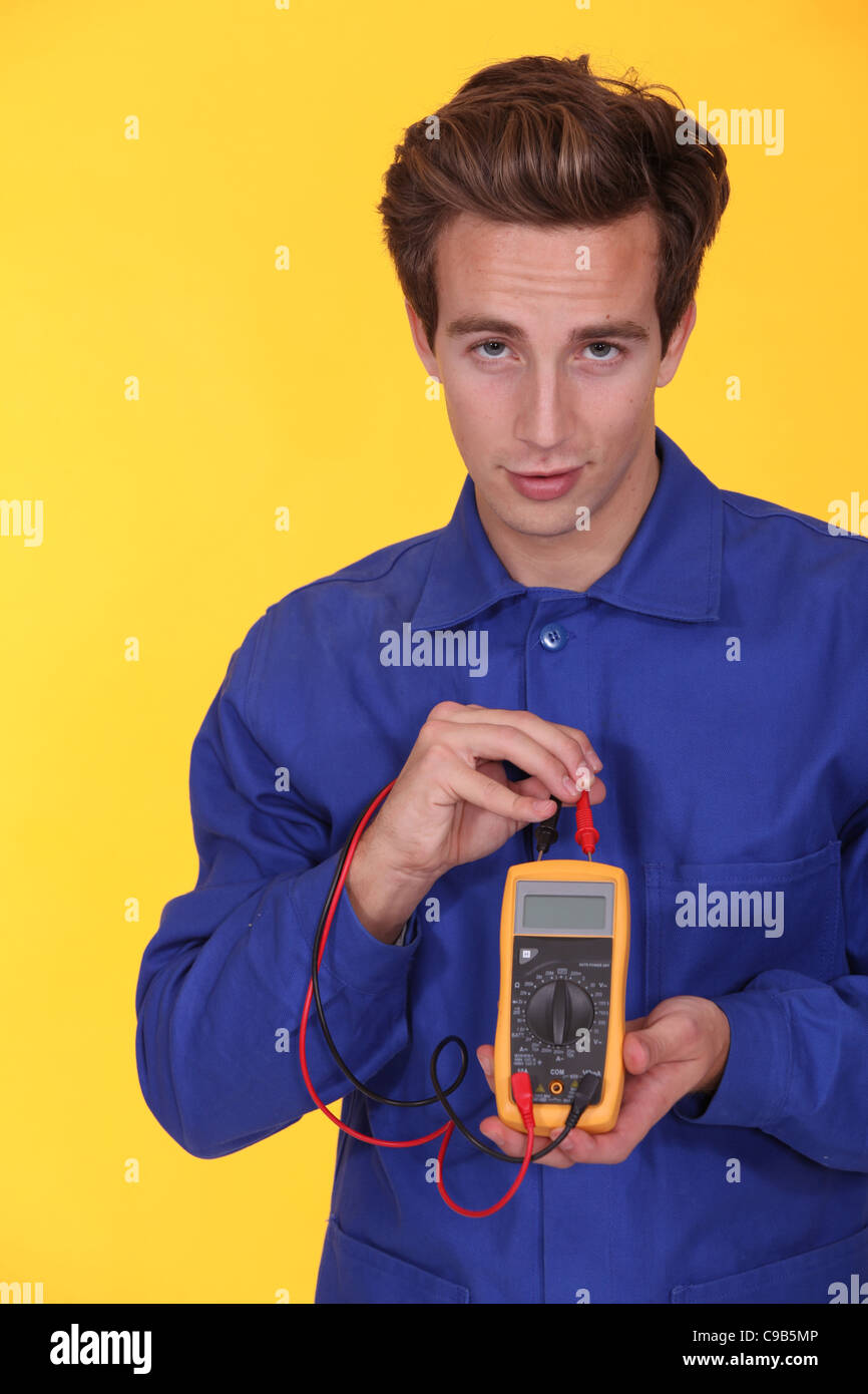 Electrician using a multimeter Stock Photo - Alamy