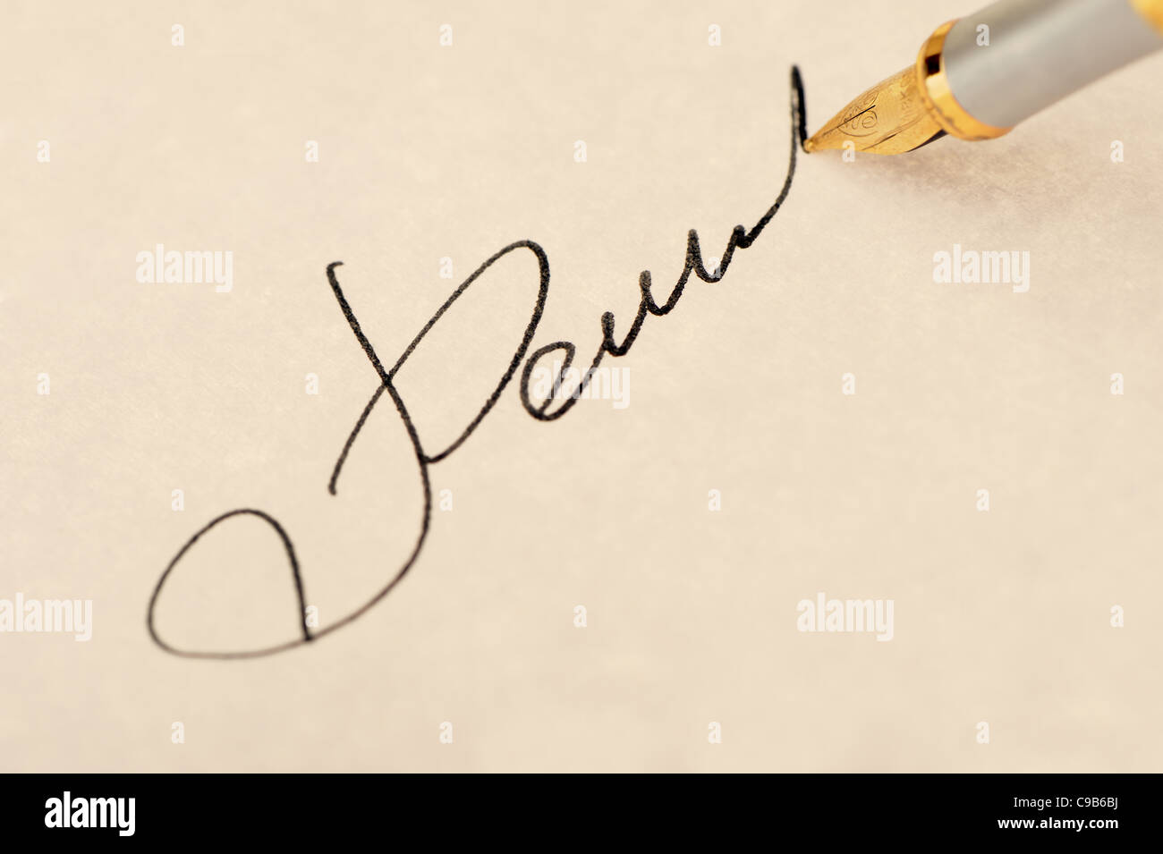 The signature close up and fountain pen.Old yellow paper. Selective ...