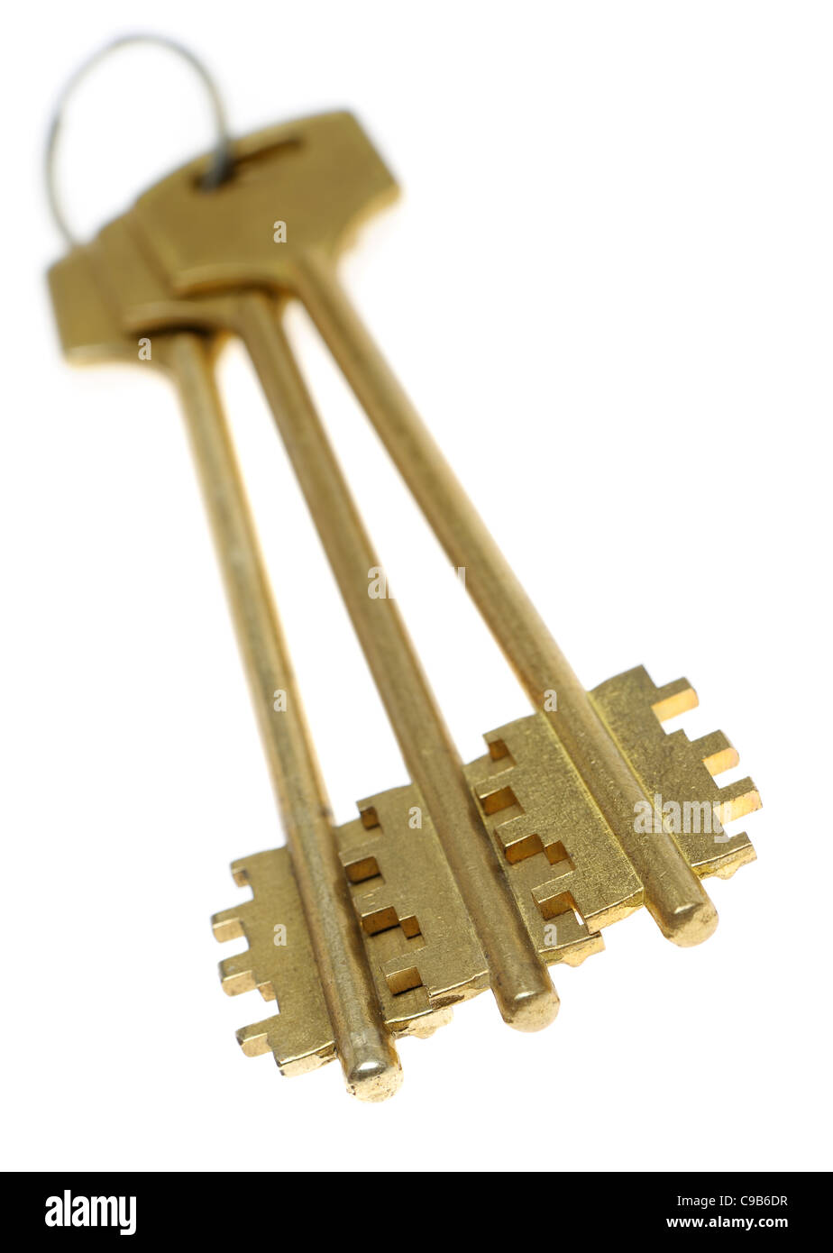 Three gold keys. It is isolated on a white background Stock Photo - Alamy